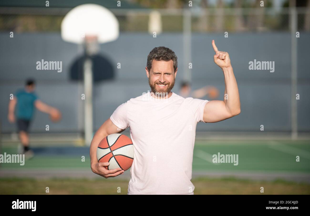 muscular man with basketball ball. sport trainer or basketball player ...