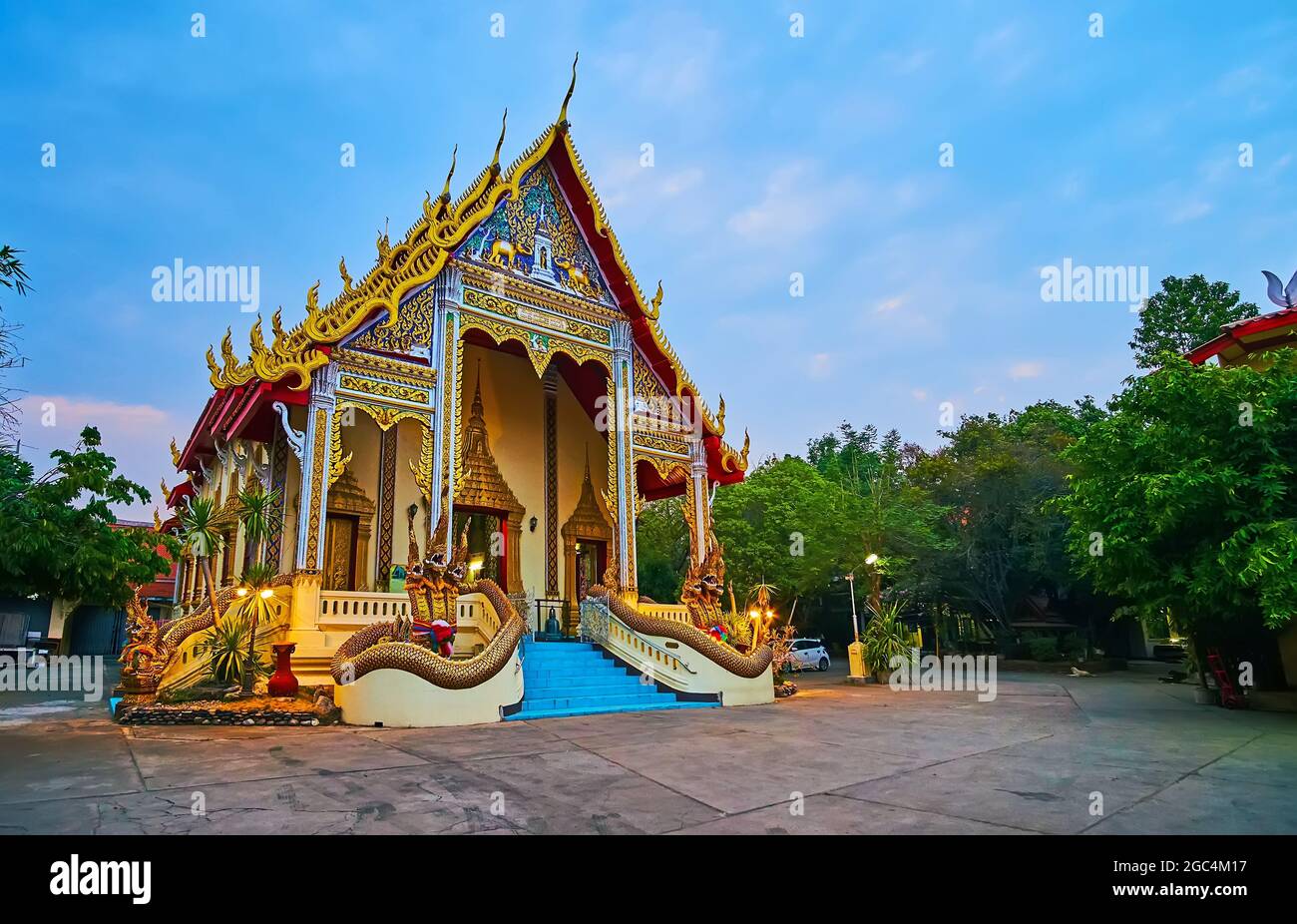 The scenic Wat Suan Dok Viharn with gilt carved bargeboards, gable roof ...