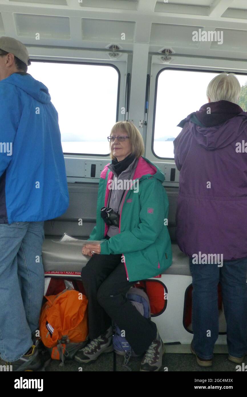 on a boat whale hunting in Alaska girl female lady window coat jacket ...