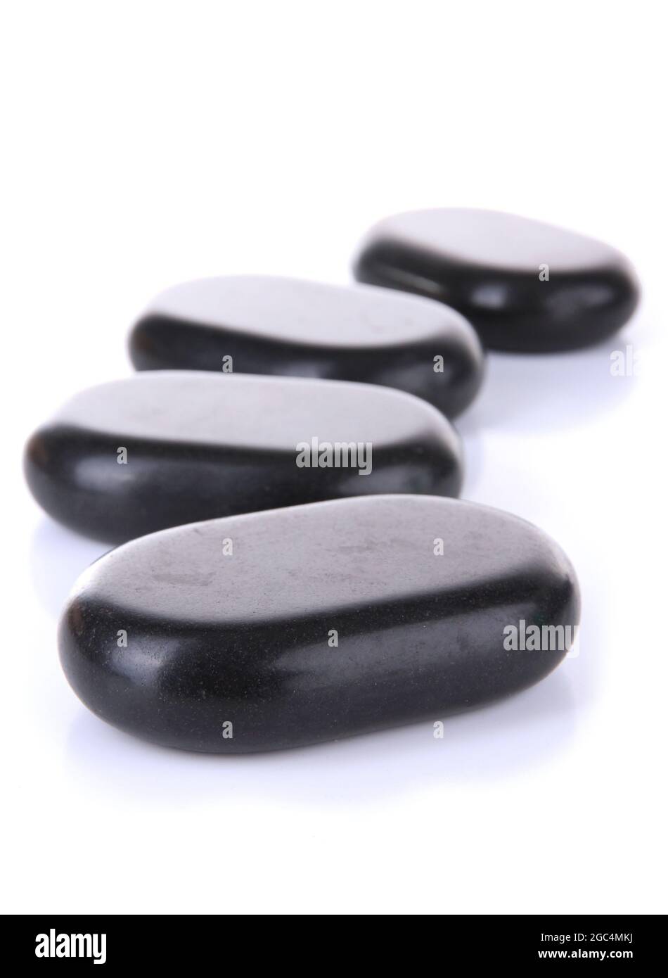 Spa stones isolated on white Stock Photo - Alamy