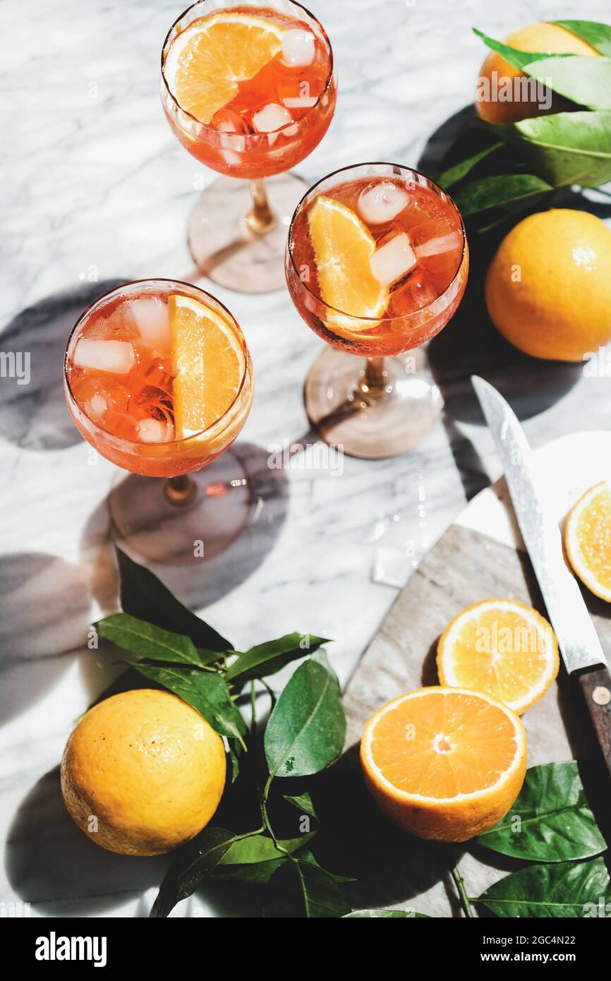 Aperol Spritz cocktail in glasses with oranges, top view Stock Photo ...