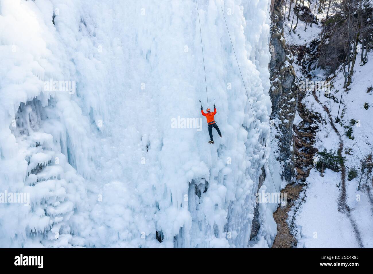 Aerial shot of an ice slope bumps, ridges, and icicles by which ...