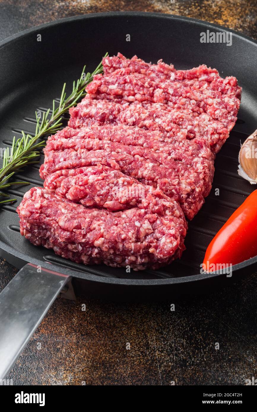 Minced marble beef meat, on old dark rustic background Stock Photo - Alamy