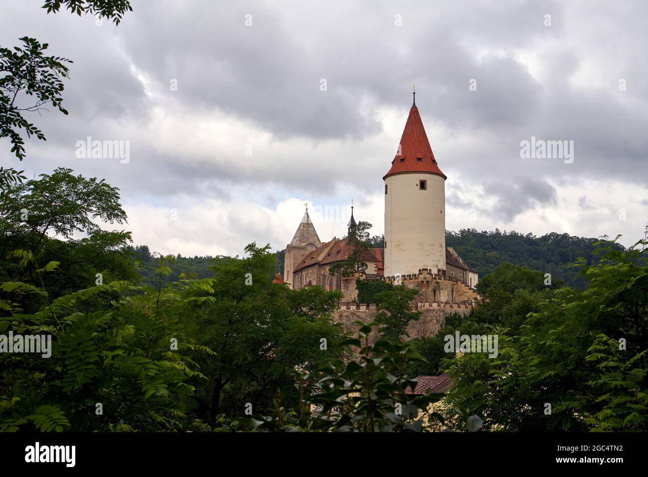 KRIVOKLAT, CZECH REPUBLIC - JULY 18, 2021: Castle with trees and clouds ...