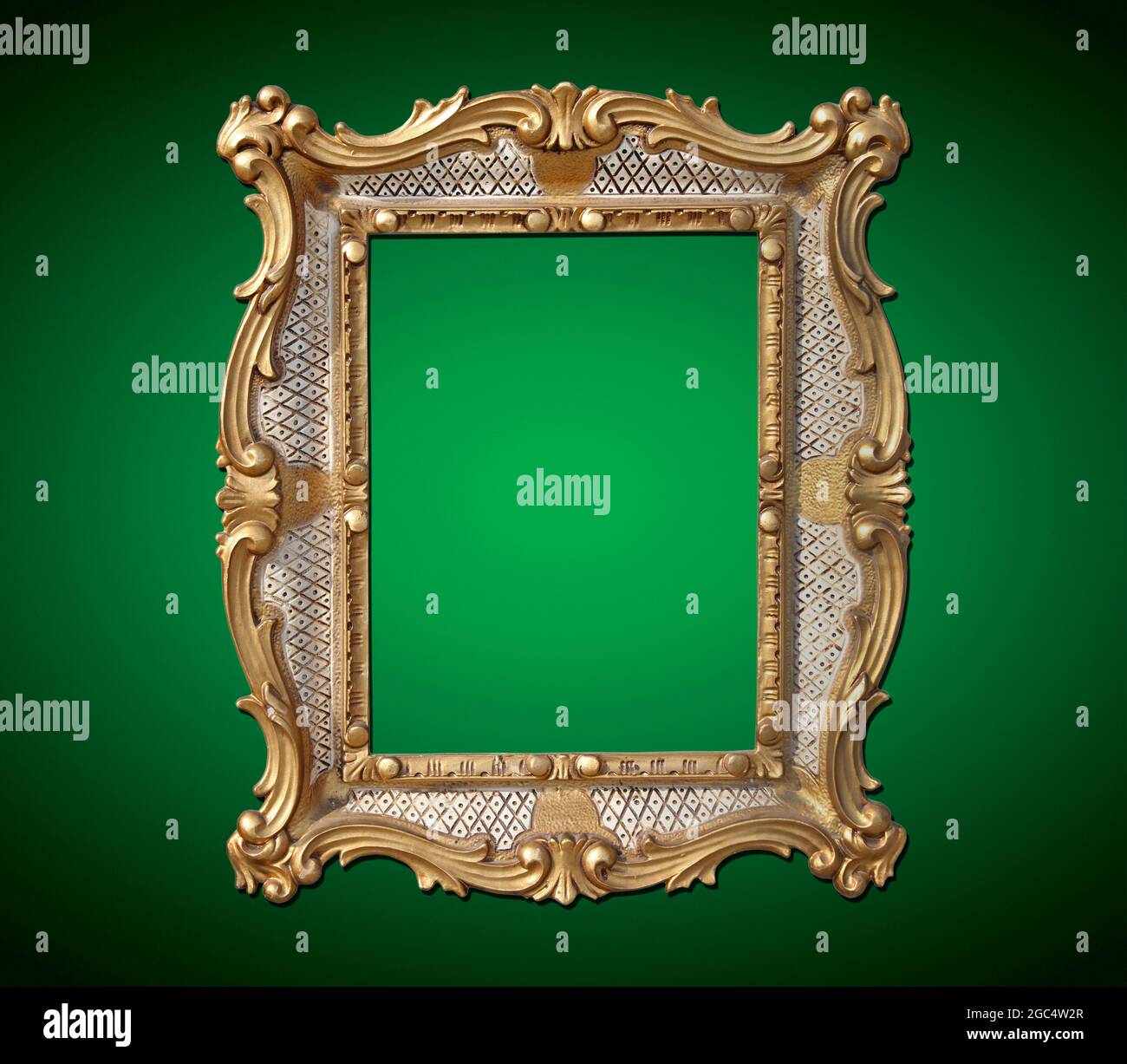 Vintage empty old frame with gold details on green emerald background ...