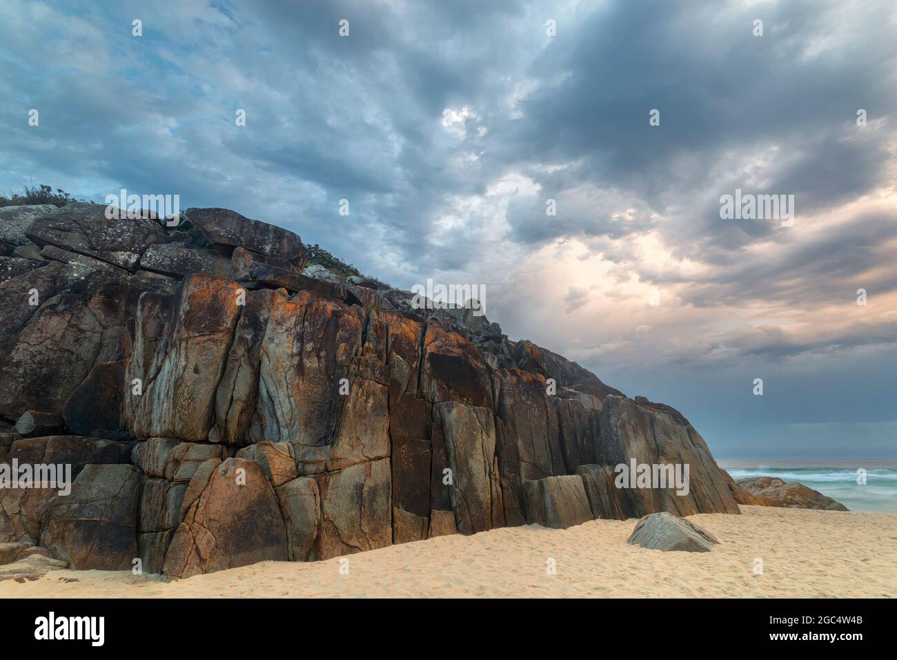 a close up of a rock mountain on beach Stock Photo - Alamy
