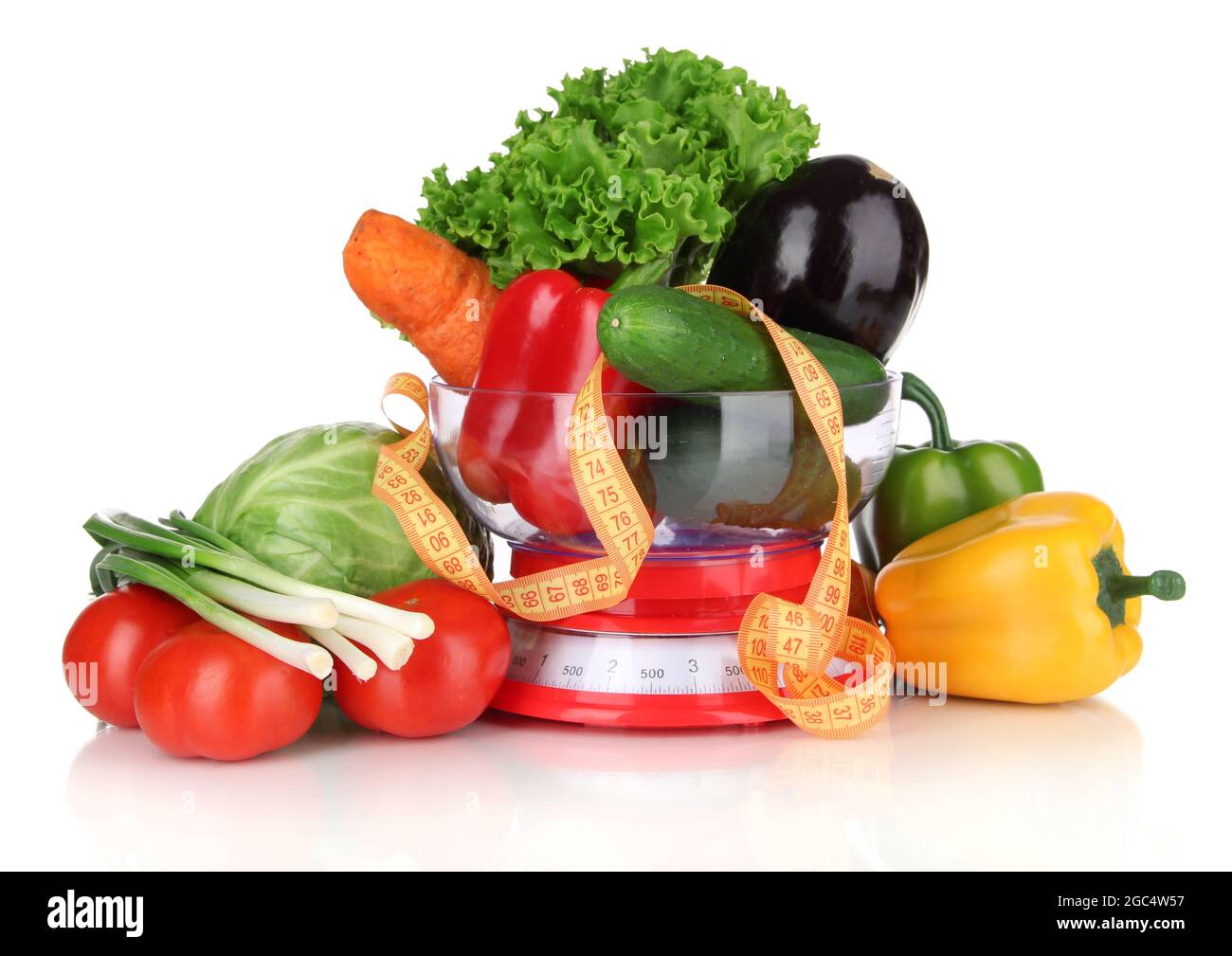 Fresh vegetables in scales isolated on white Stock Photo - Alamy