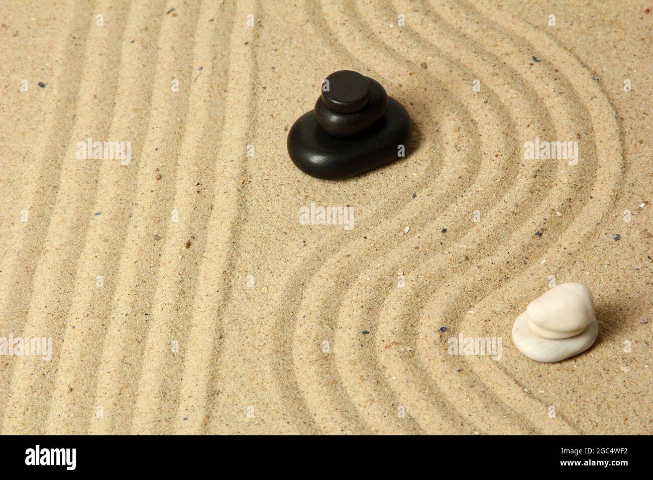 Zen garden with raked sand and round stones close up Stock Photo - Alamy