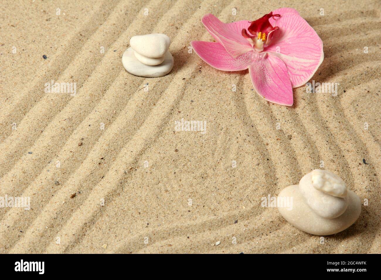 Zen garden with raked sand and round stones close up Stock Photo - Alamy
