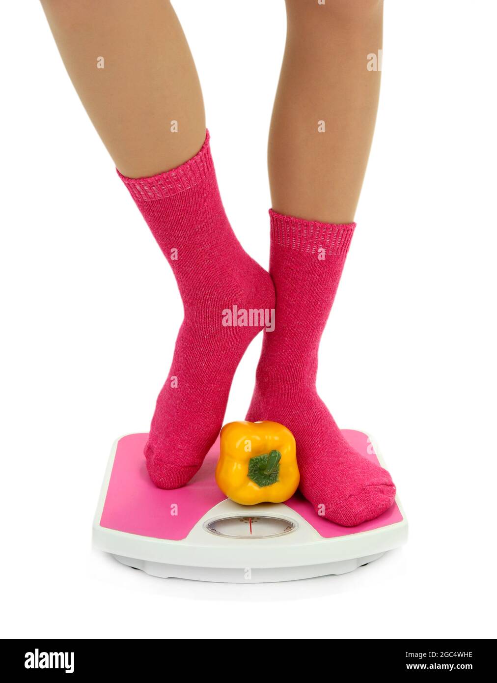 Female feet on scales, isolated on white Stock Photo - Alamy