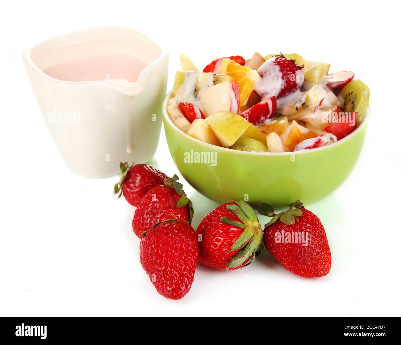 Useful fruit salad of fresh fruits and berries in bowl isolated on ...