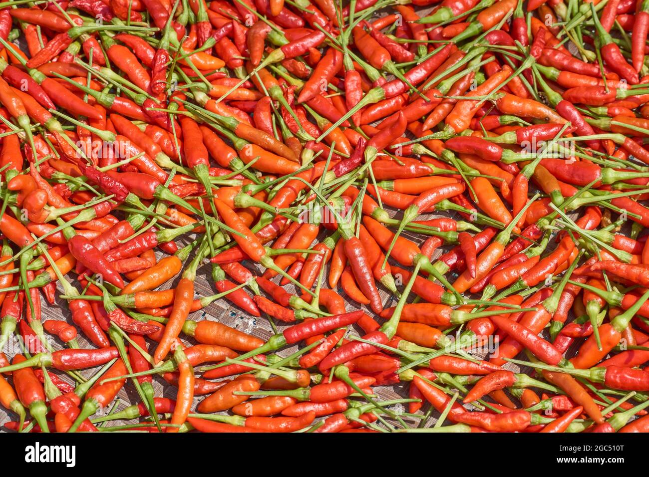 Chili peppers background Stock Photo - Alamy