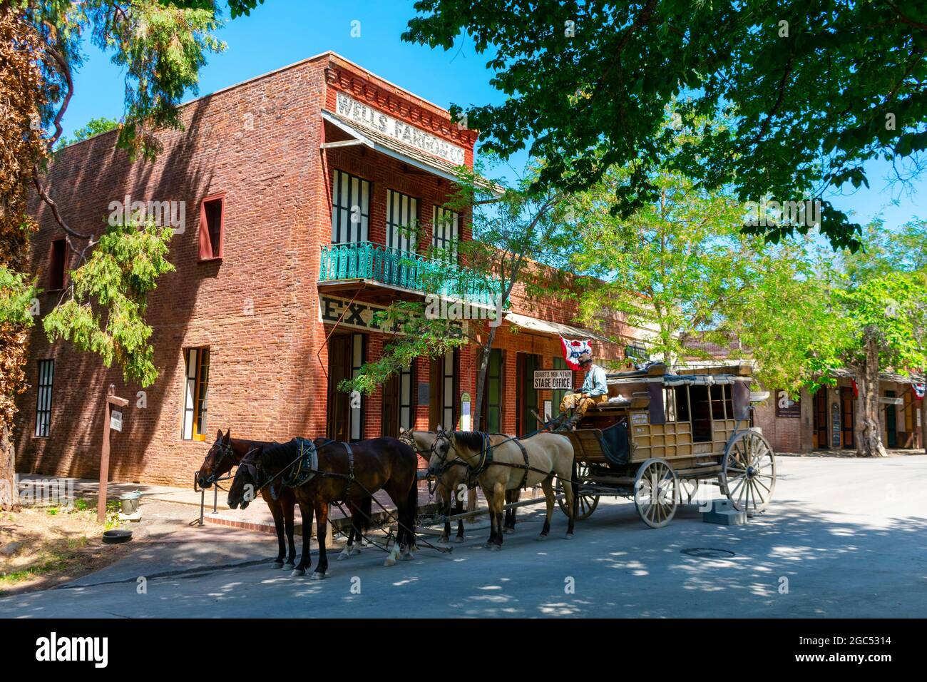 Horse drawn stagecoach ride waits for passengers near preserved ...