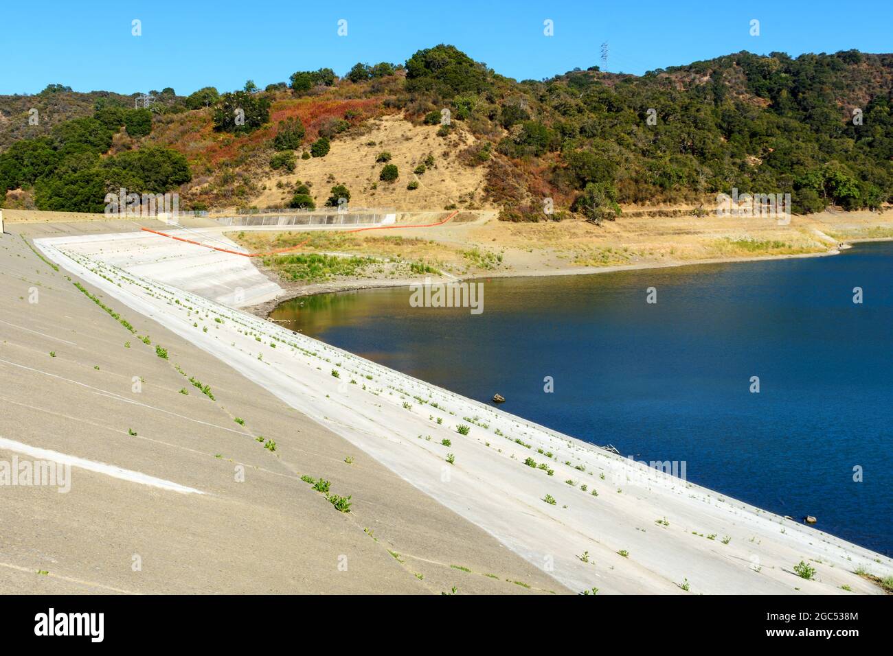 Concrete dam of almost dried, low water level Stevens Creek reservoir ...