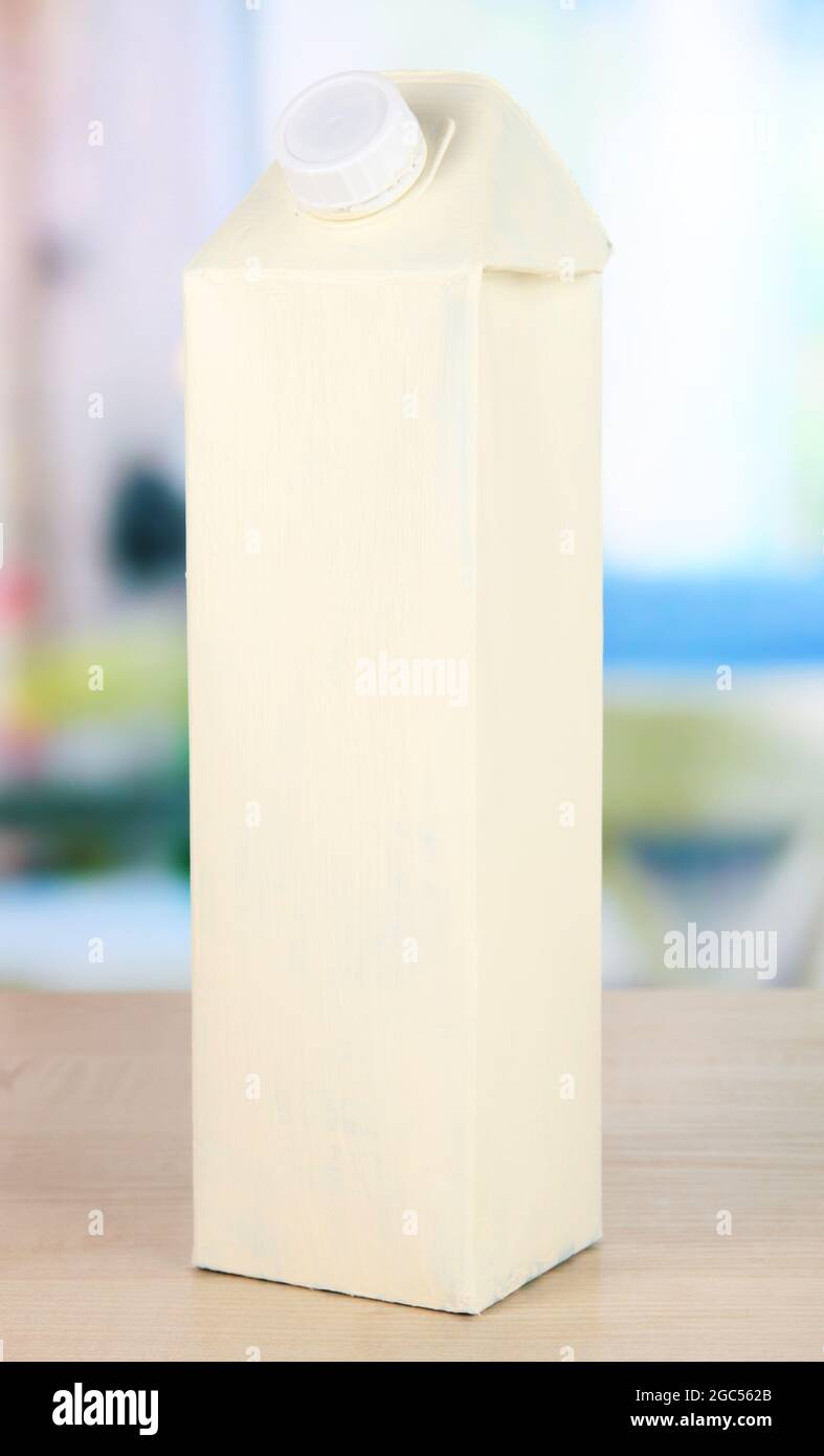 Milk pack on table in kitchen Stock Photo - Alamy