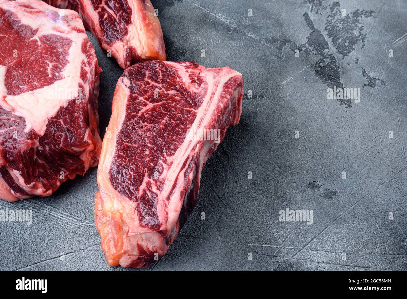 Dry aged raw beef meat, tomahawk, t bone or porterhouse and club steak ...