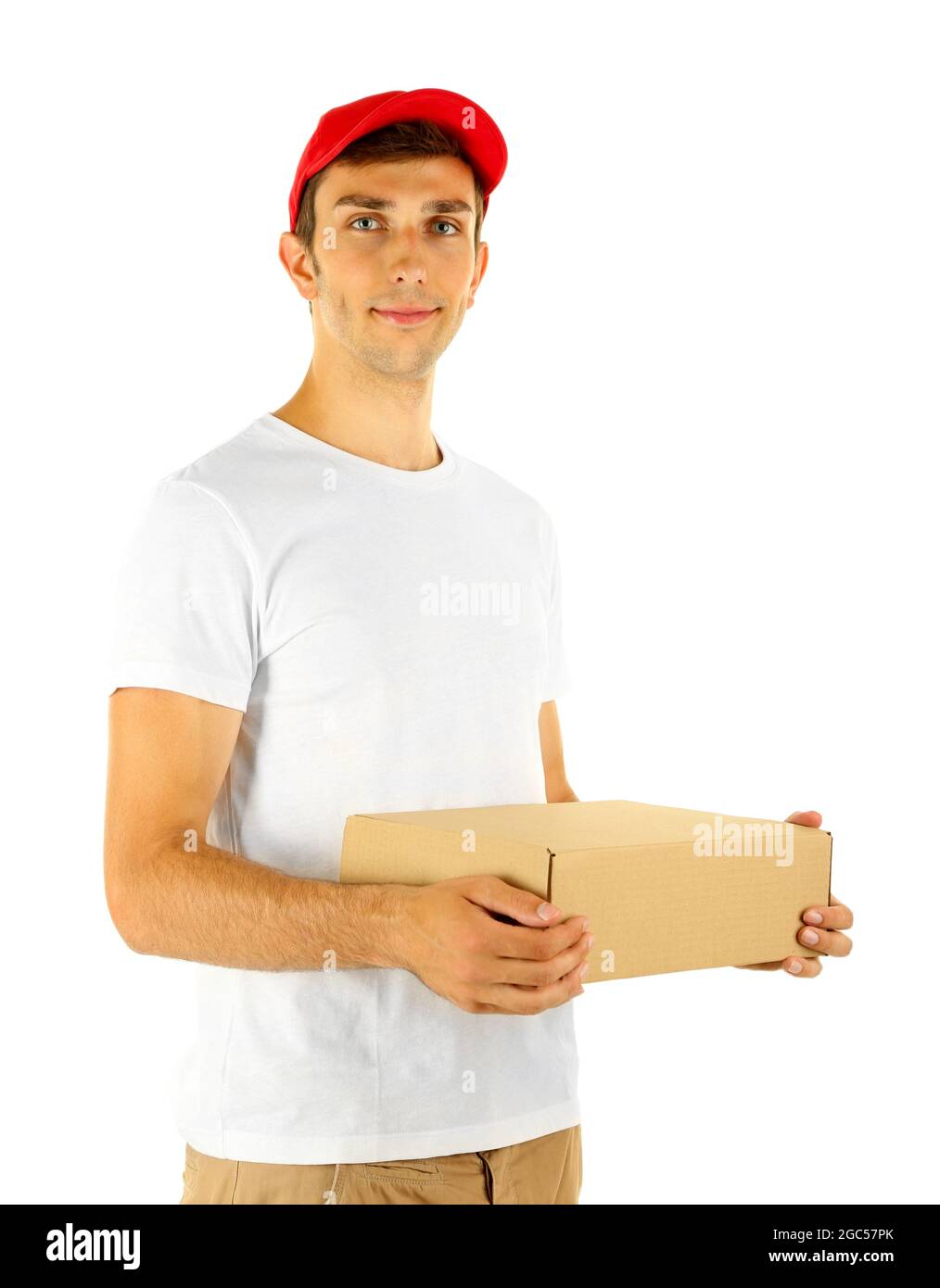 Young delivery man holding parcel, isolated on white Stock Photo - Alamy
