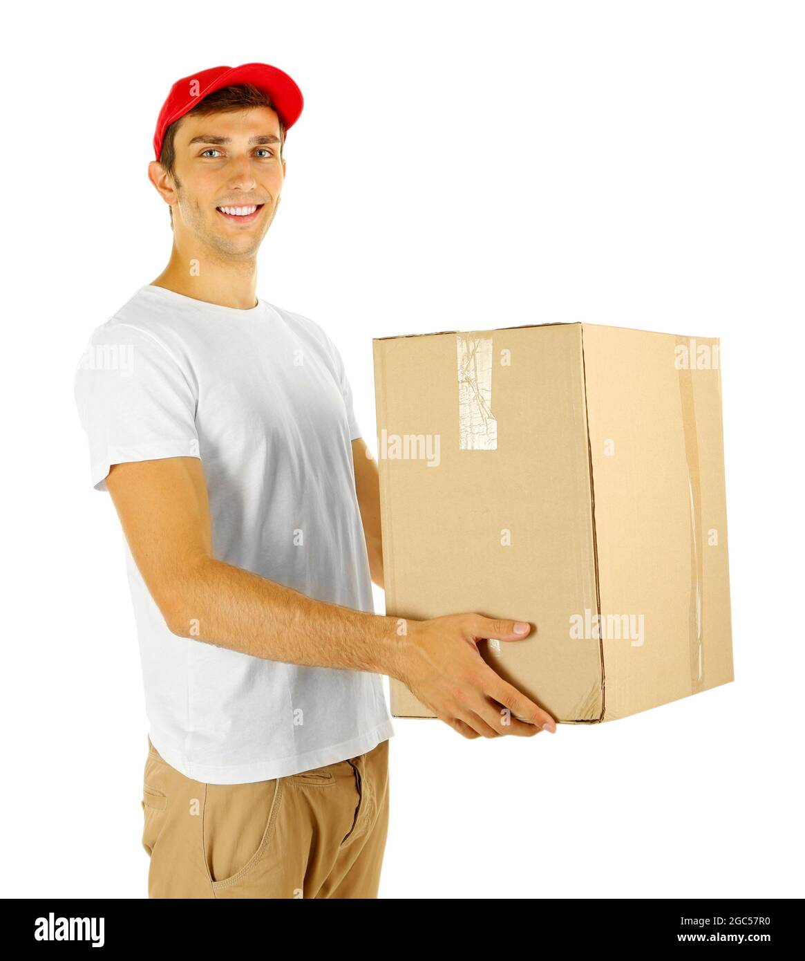 Young delivery man holding parcel, isolated on white Stock Photo - Alamy