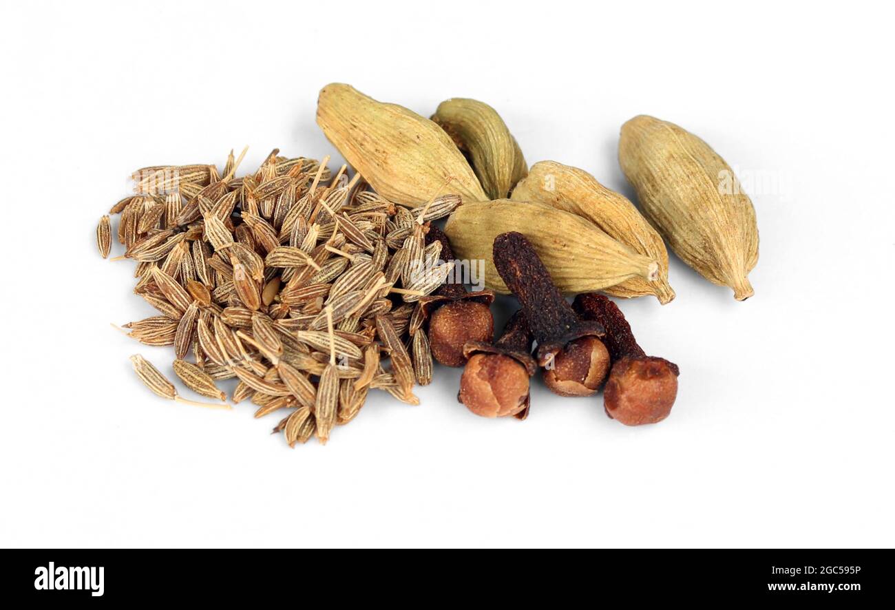 Cumin, Cardamom and Clove isolated on white background Stock Photo - Alamy