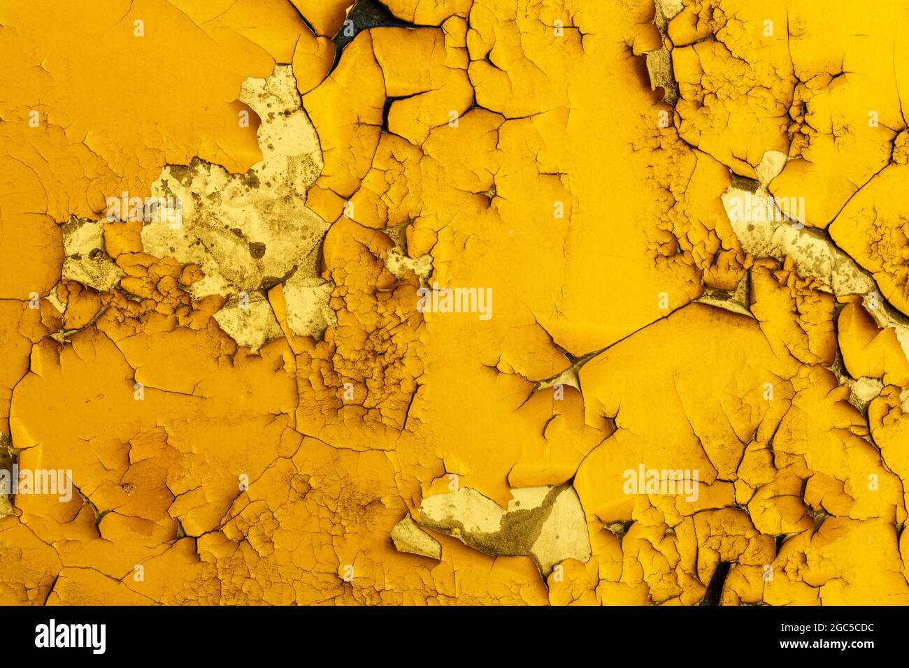 concrete wall with yellow paint in cracks. background for design ...