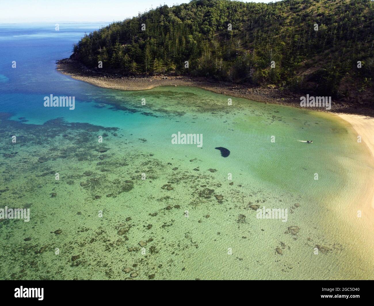 Aerial view of small boat arriving at beach, Oyster Bay, Brampton ...