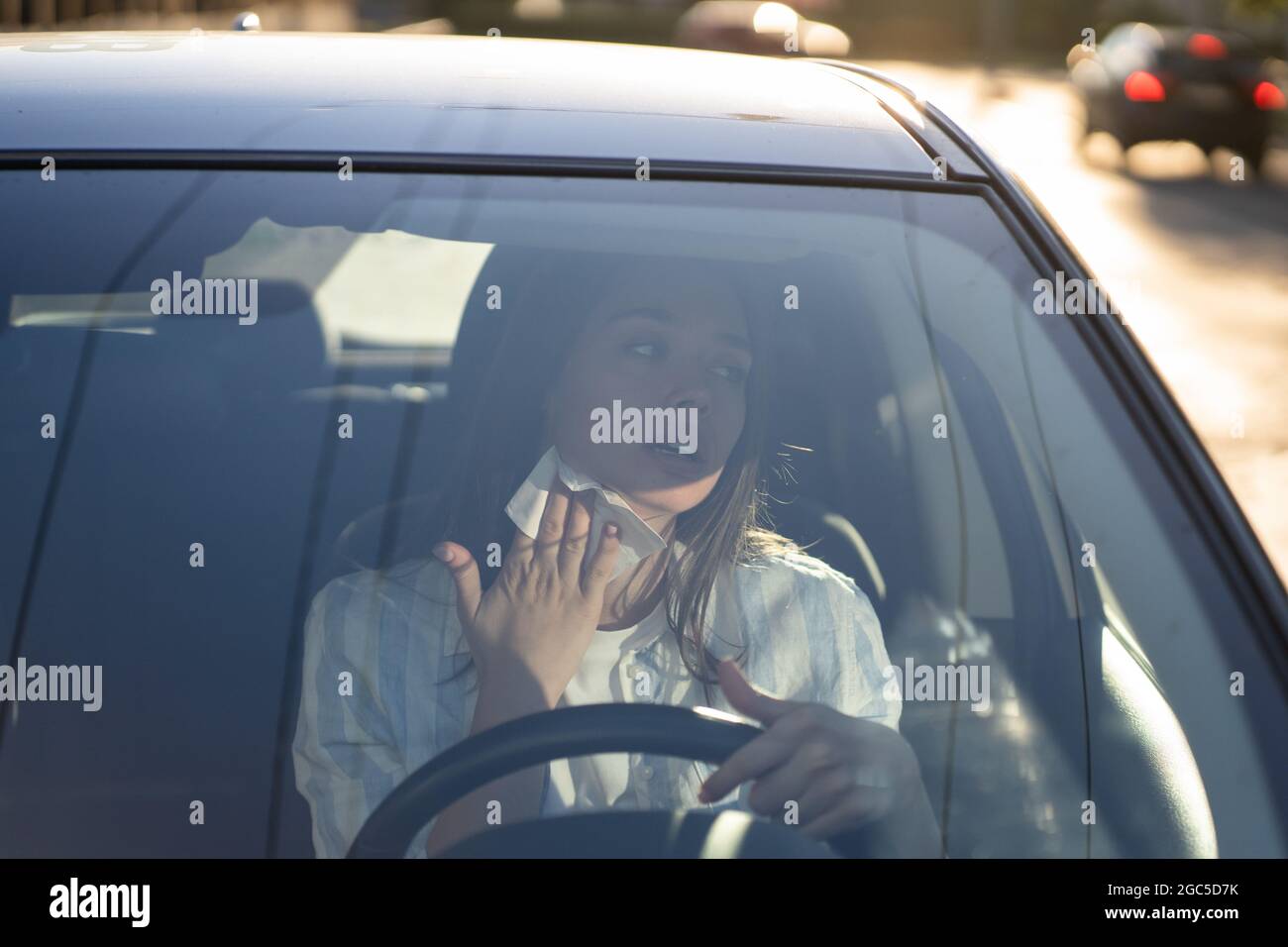 Woman driver being hot during heat wave in car, suffering from hot ...