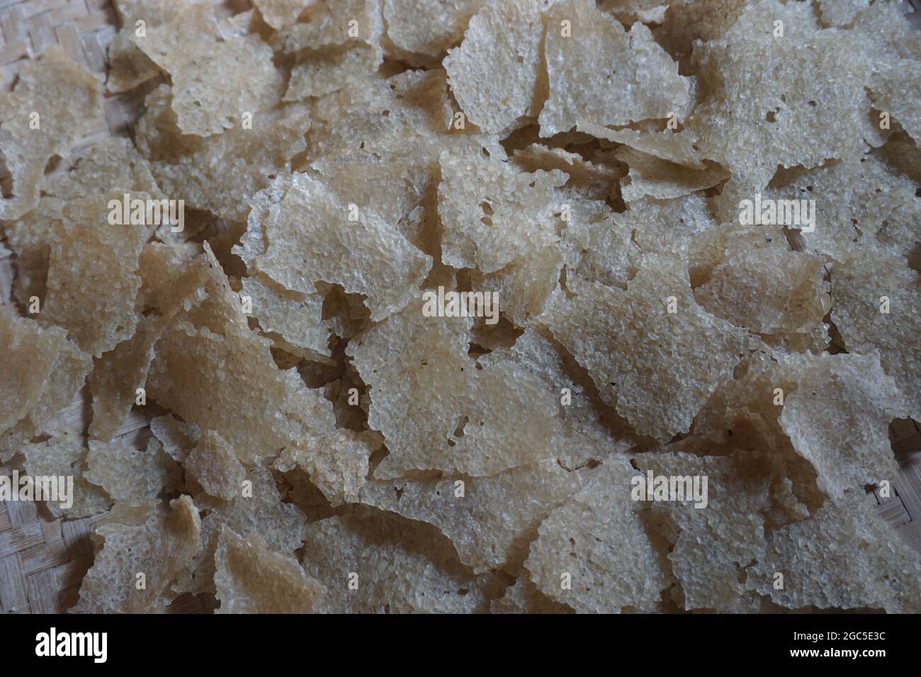 Raw kerupuk gendar (puli, kerupuk beras, Lempeng Puli) with a natural ...