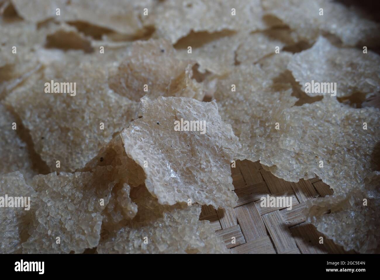 Raw kerupuk gendar (puli, kerupuk beras, Lempeng Puli) with a natural ...