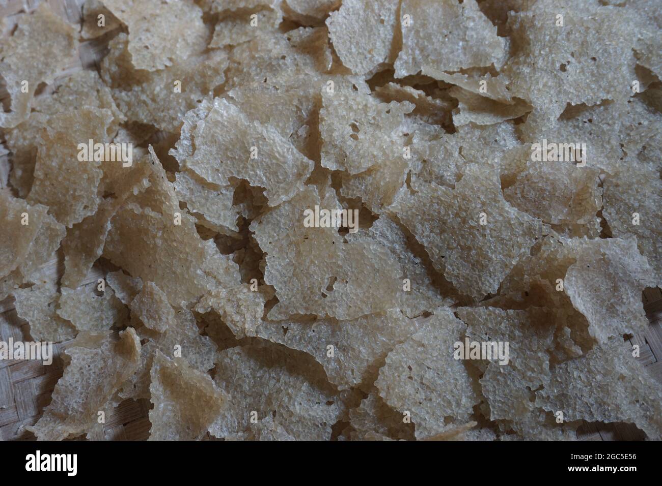 Raw kerupuk gendar (puli, kerupuk beras, Lempeng Puli) with a natural ...
