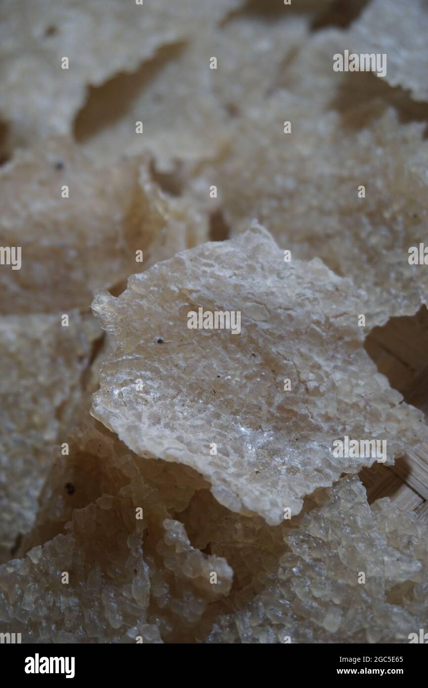 Raw kerupuk gendar (puli, kerupuk beras, Lempeng Puli) with a natural ...