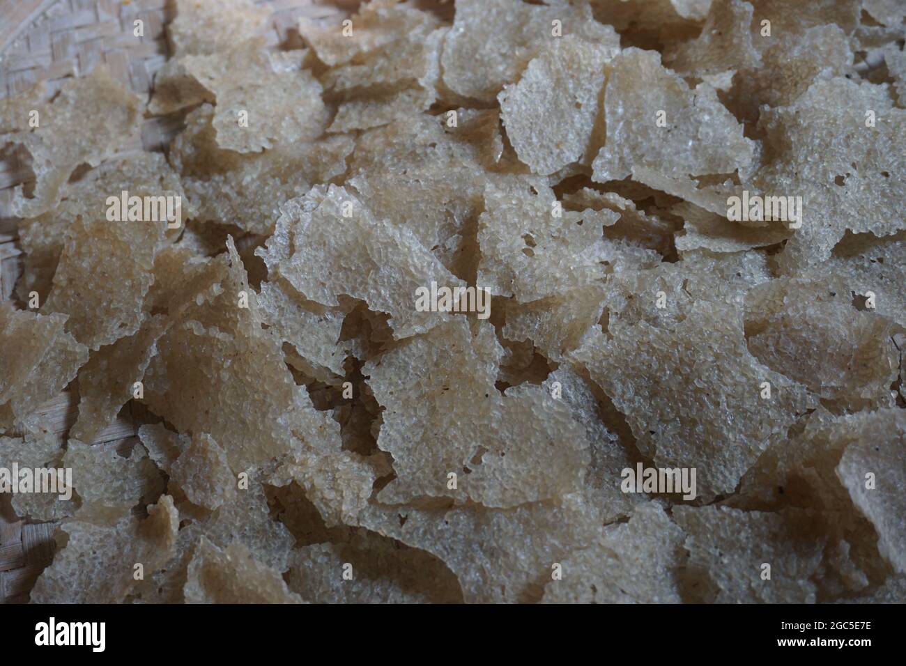 Raw kerupuk gendar (puli, kerupuk beras, Lempeng Puli) with a natural ...