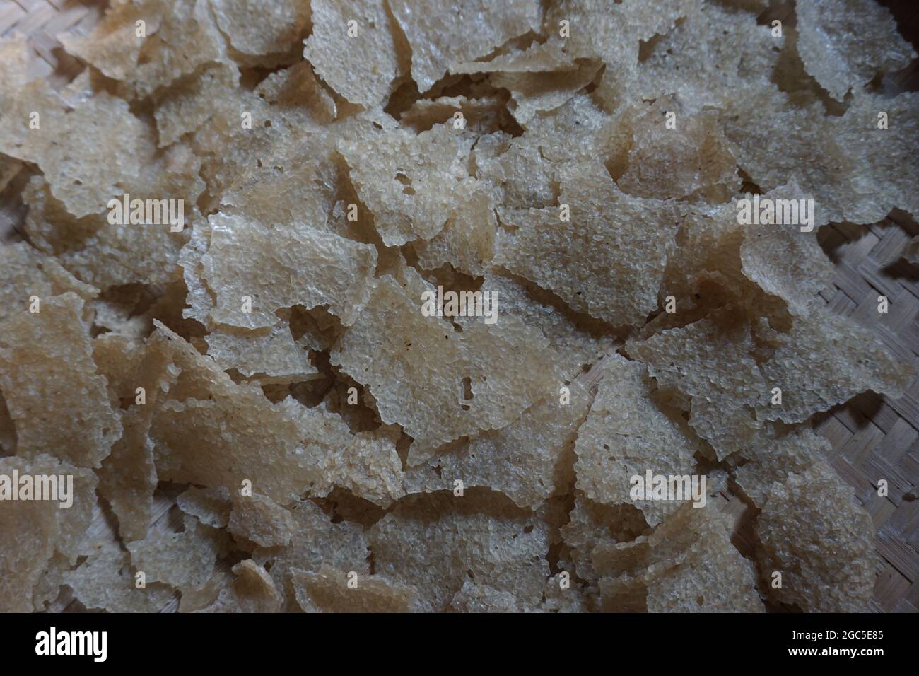 Raw kerupuk gendar (puli, kerupuk beras, Lempeng Puli) with a natural ...