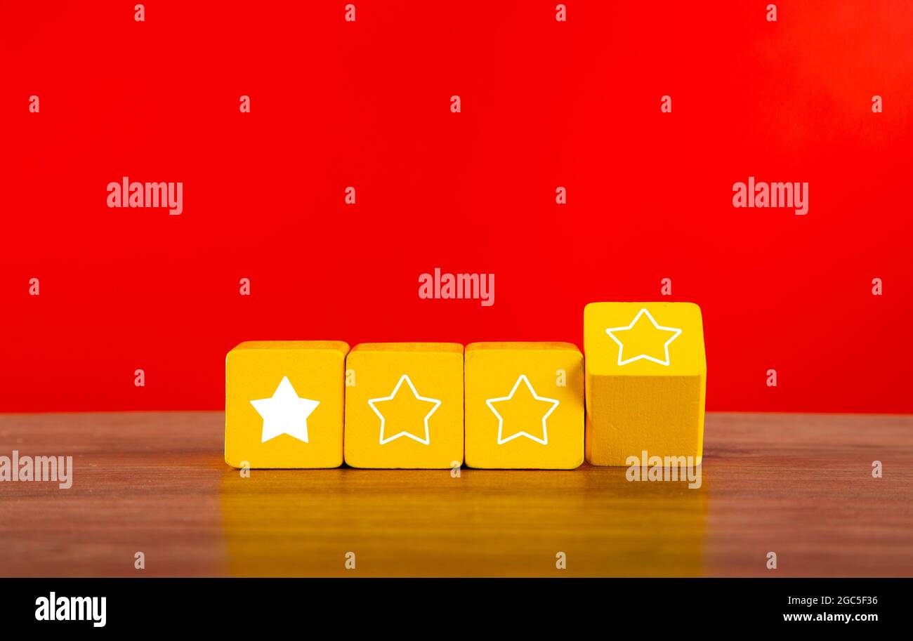 Wooden cubes with one stars out of four. Concept of poor service rating ...