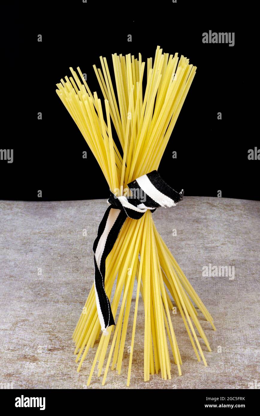 Tower of Spaghetti noodles on the table Stock Photo - Alamy