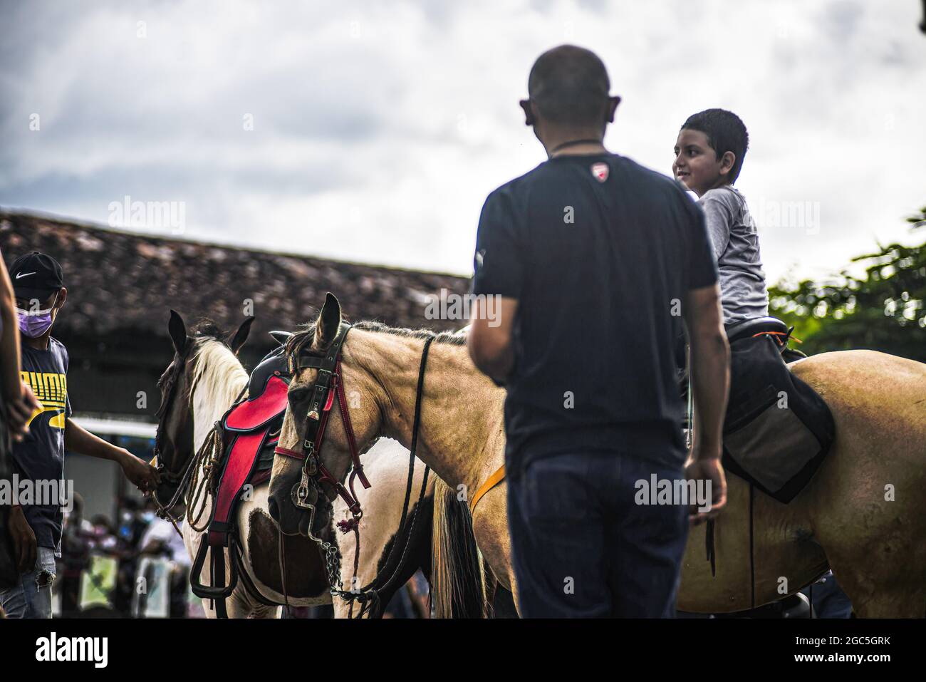A boy rides a horse through the Suchitoto main square as El Salvador's ...