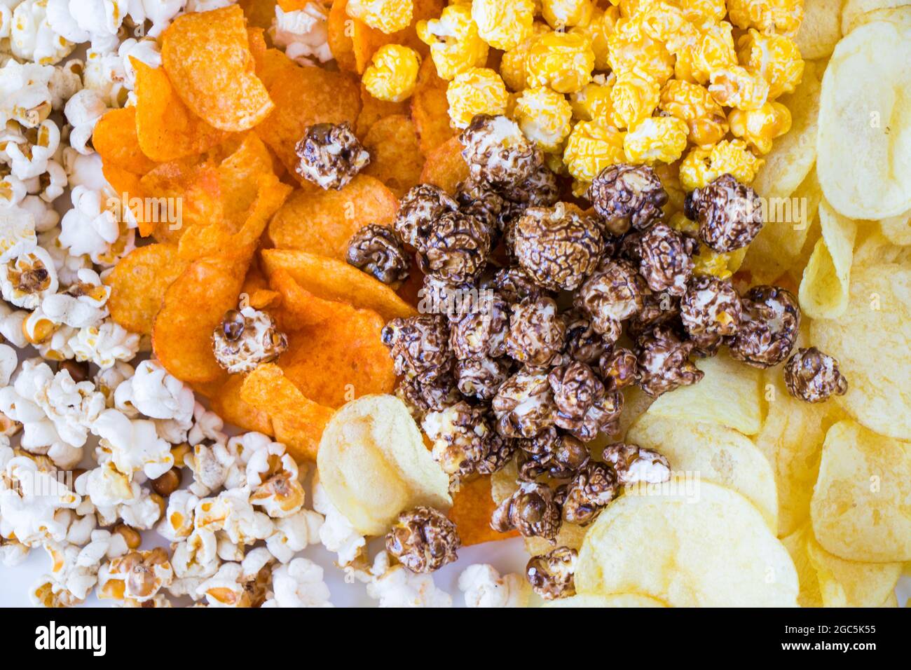 Fried popcorn and chips on the white background, low angle view Stock ...