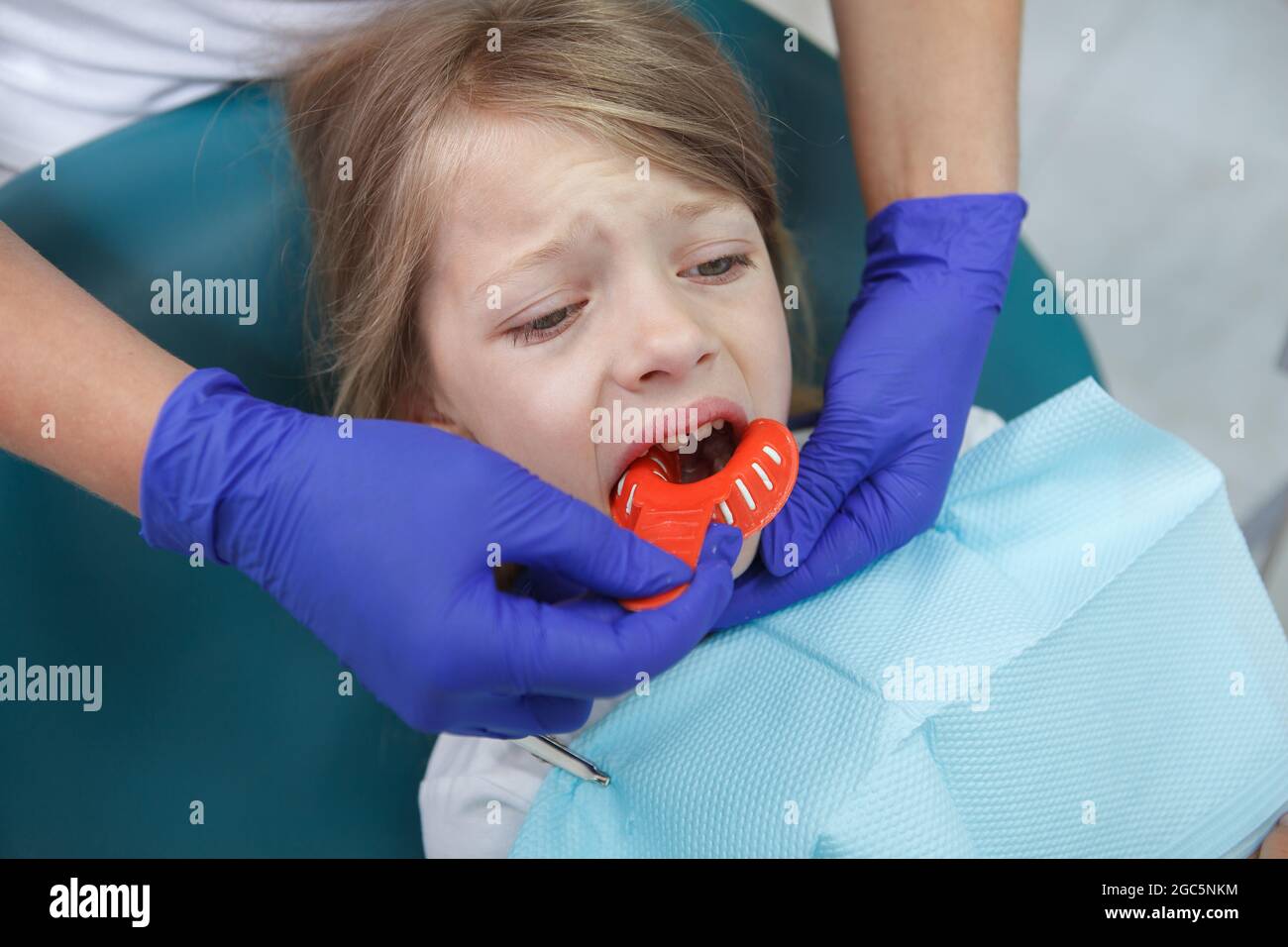 Close up of a sad little girl crying during dental treatment Stock ...