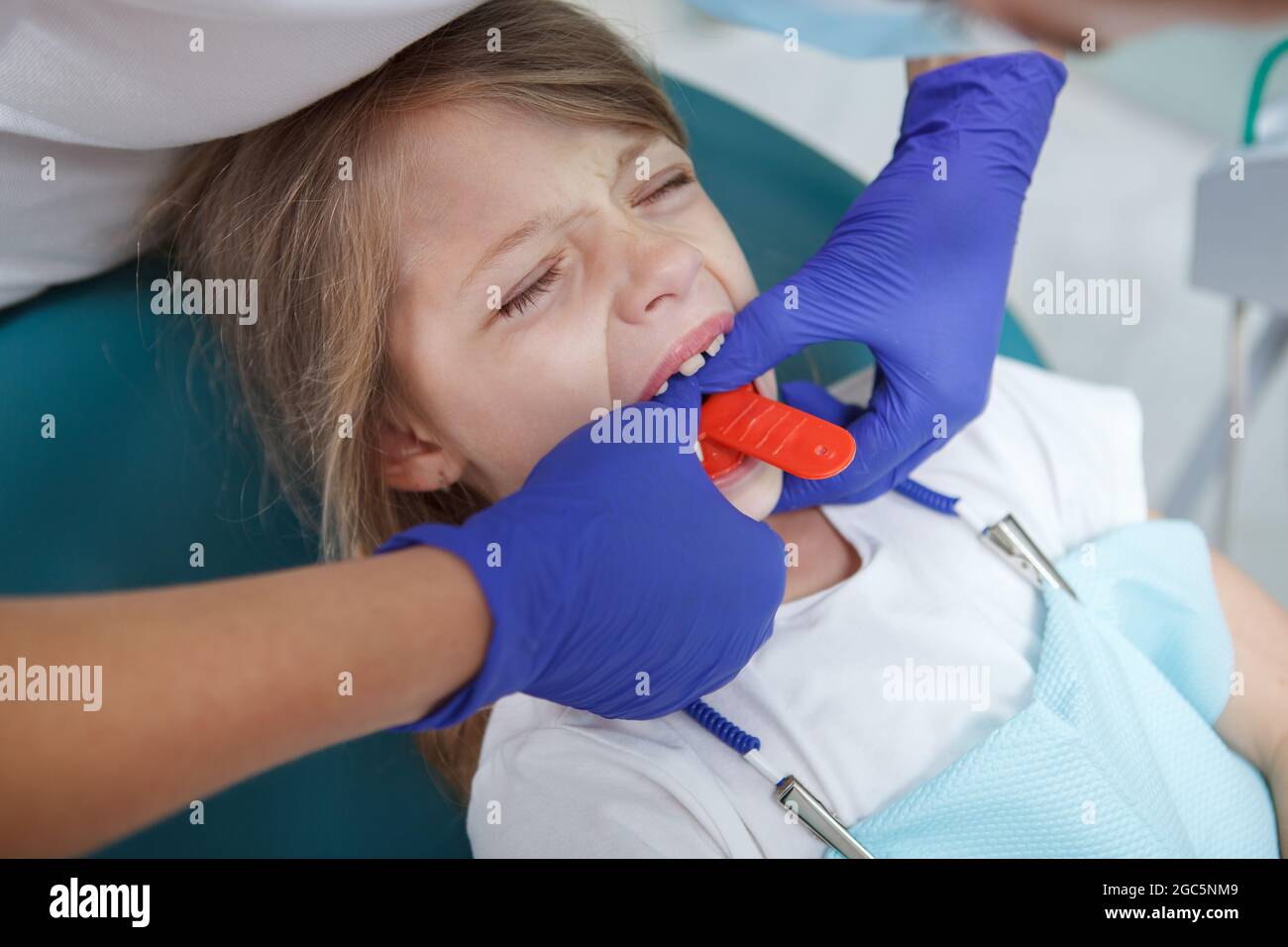Cropped shot of dentist making teeth impressions of a child patients ...
