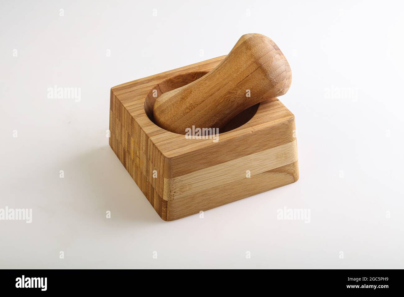 Wooden mortar for kitchen isolated over background Stock Photo - Alamy