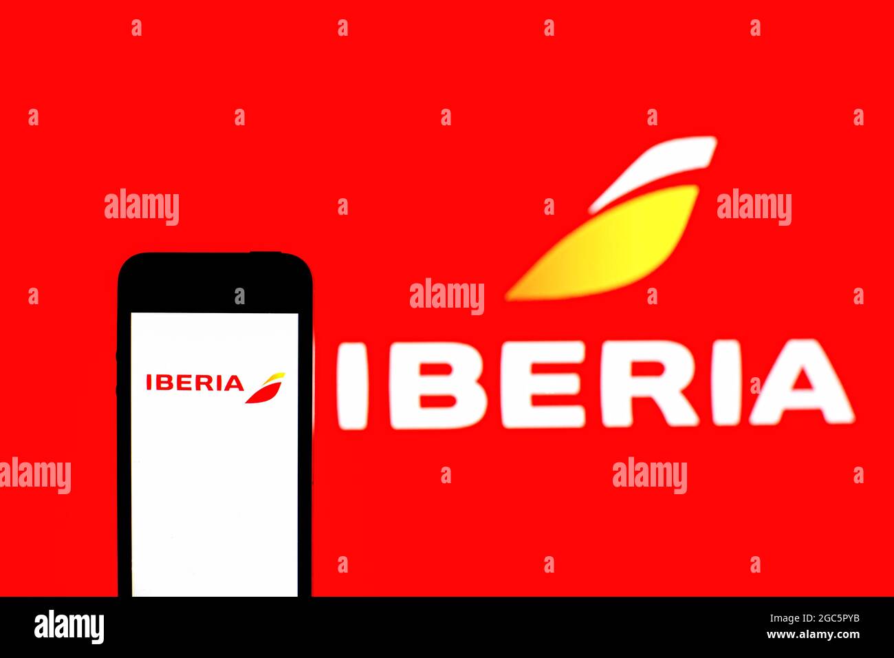 In this photo illustration, a Iberia S.A logo seen displayed on a ...