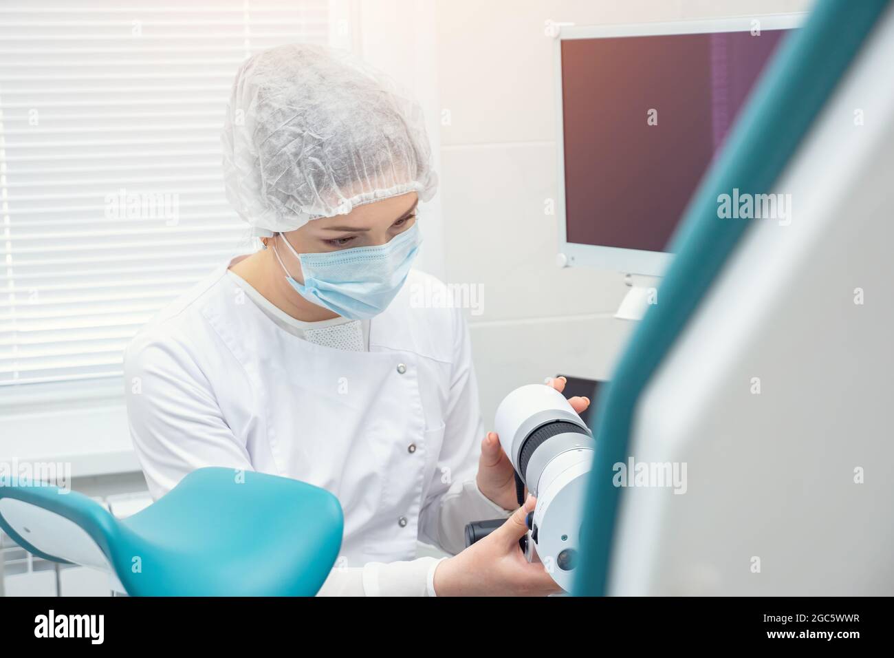 gynecologist prepares the colposcope before the patient arrives Stock ...