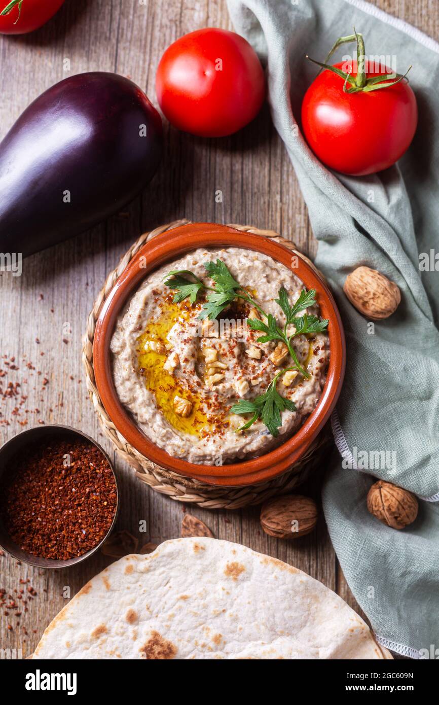 Levantine cuisine appetizer of baked eggplant and sesame paste with ...