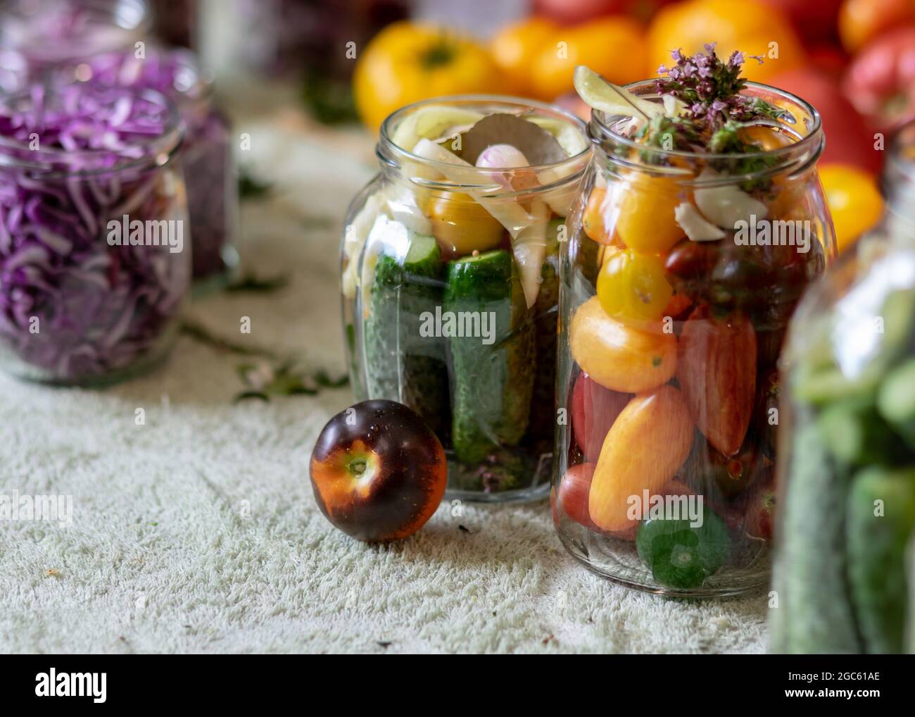 glass jars with different colors, types, shapes of vegetables ...