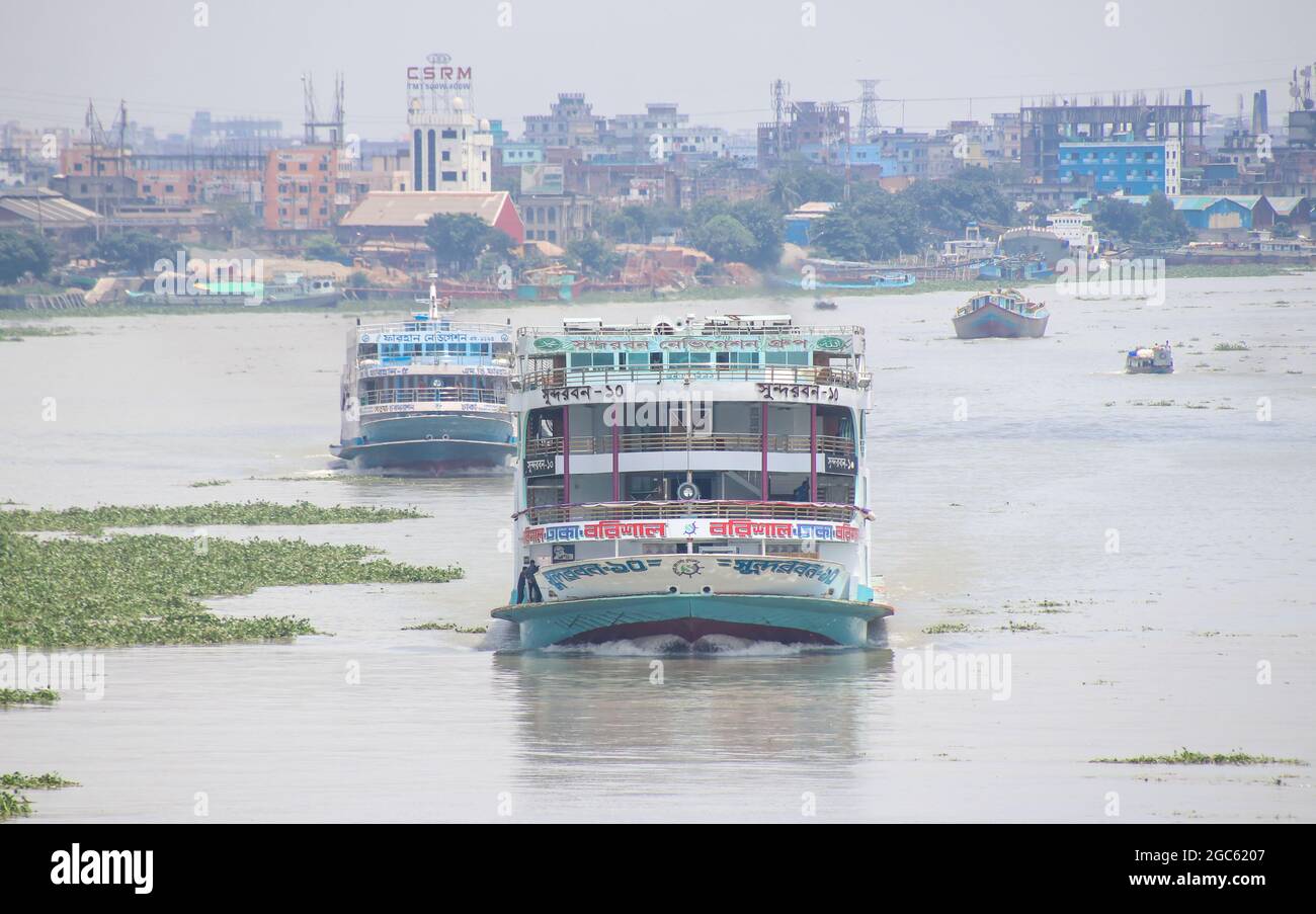 Local Passenger ferry returning to Dhaka river port. Ferry is a very ...
