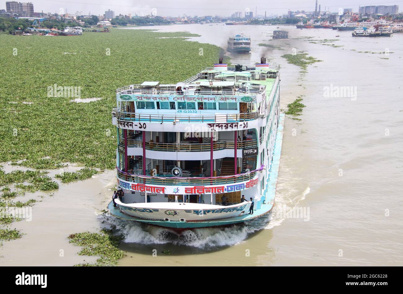 Local Passenger ferry returning to Dhaka river port. Ferry is a very ...