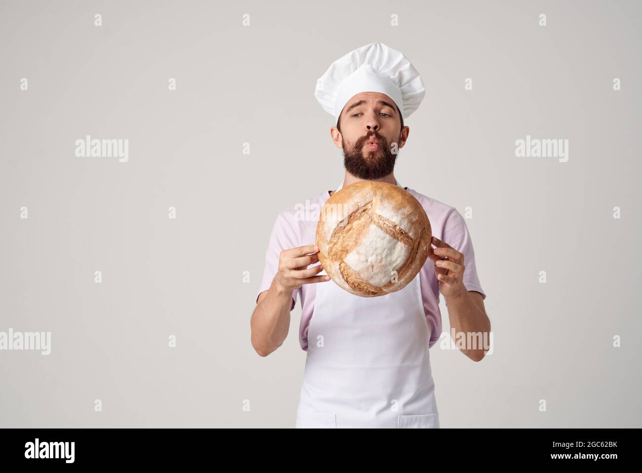 male chef holding bread in his hands cooking baker professional Stock ...