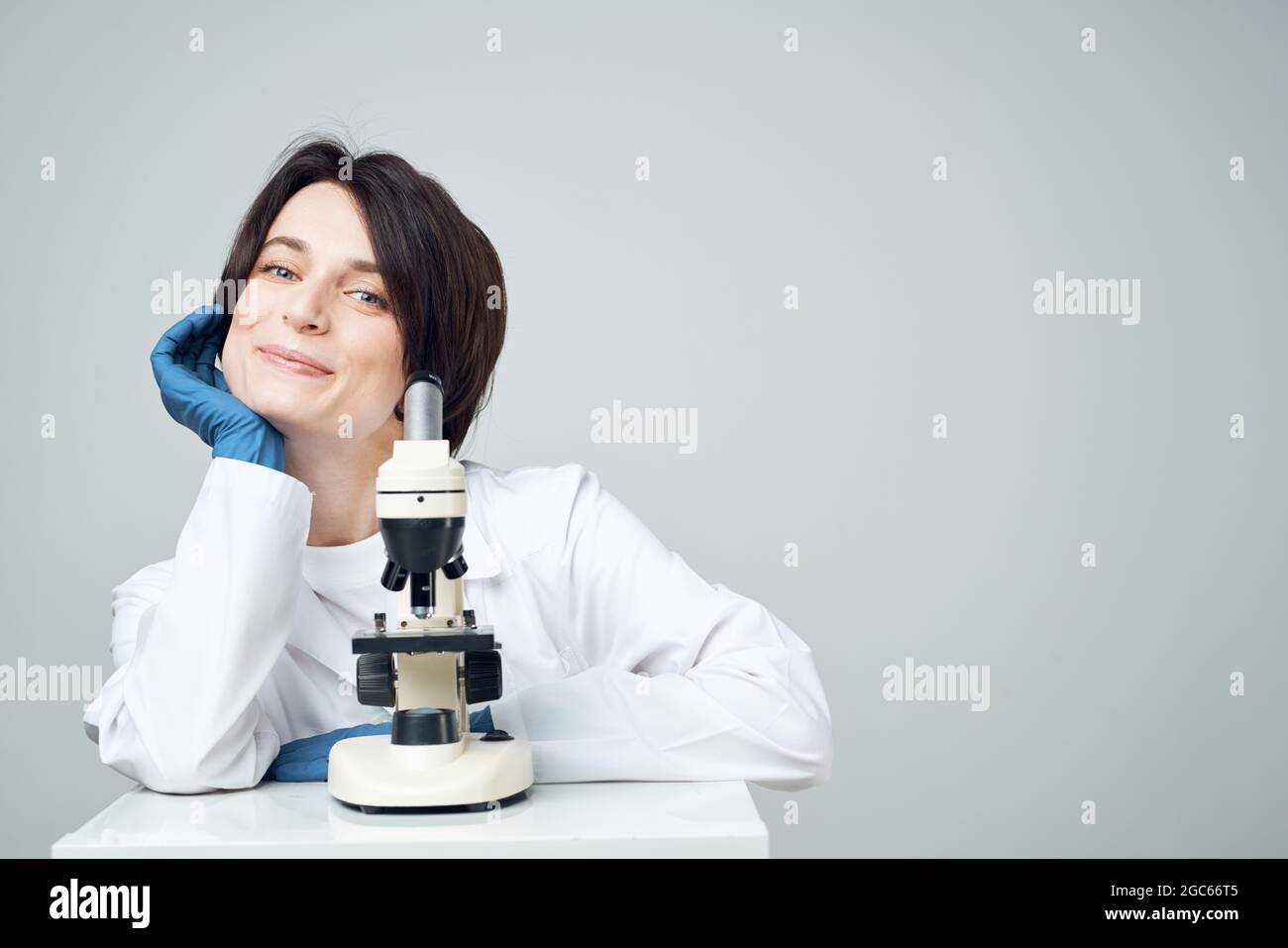 doctor laboratory assistant microscope on research table smile Stock ...