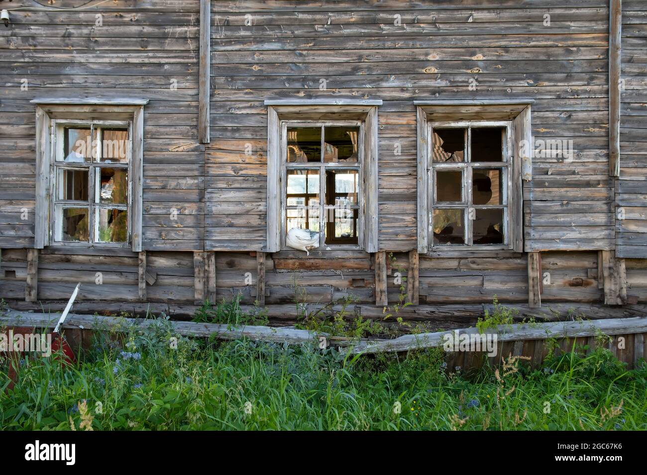 Old destroyed abandoned dirty raw wooden building with the broken out ...