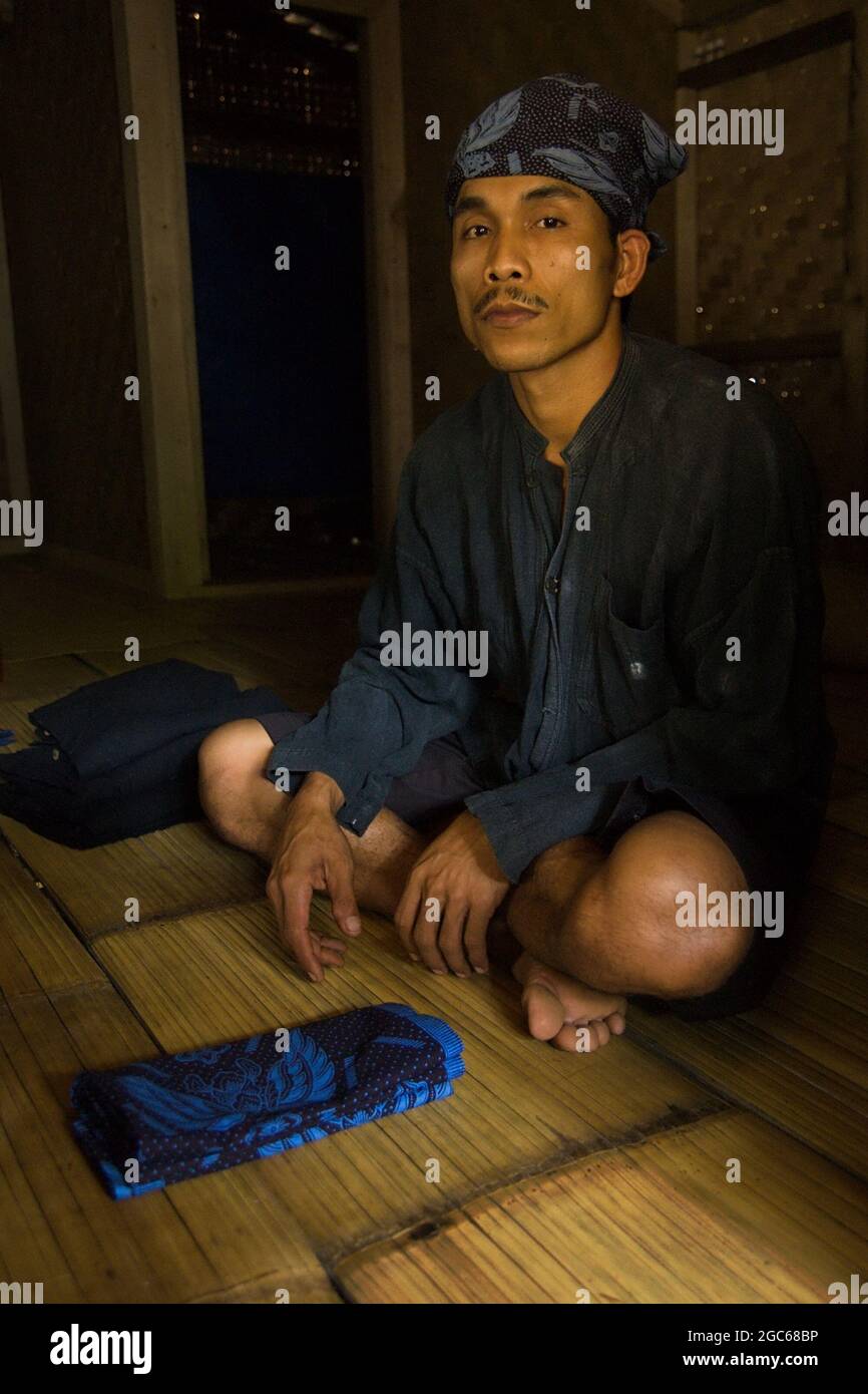 A Baduy man sits in his house. Baduy is a traditional tribe in Banten ...
