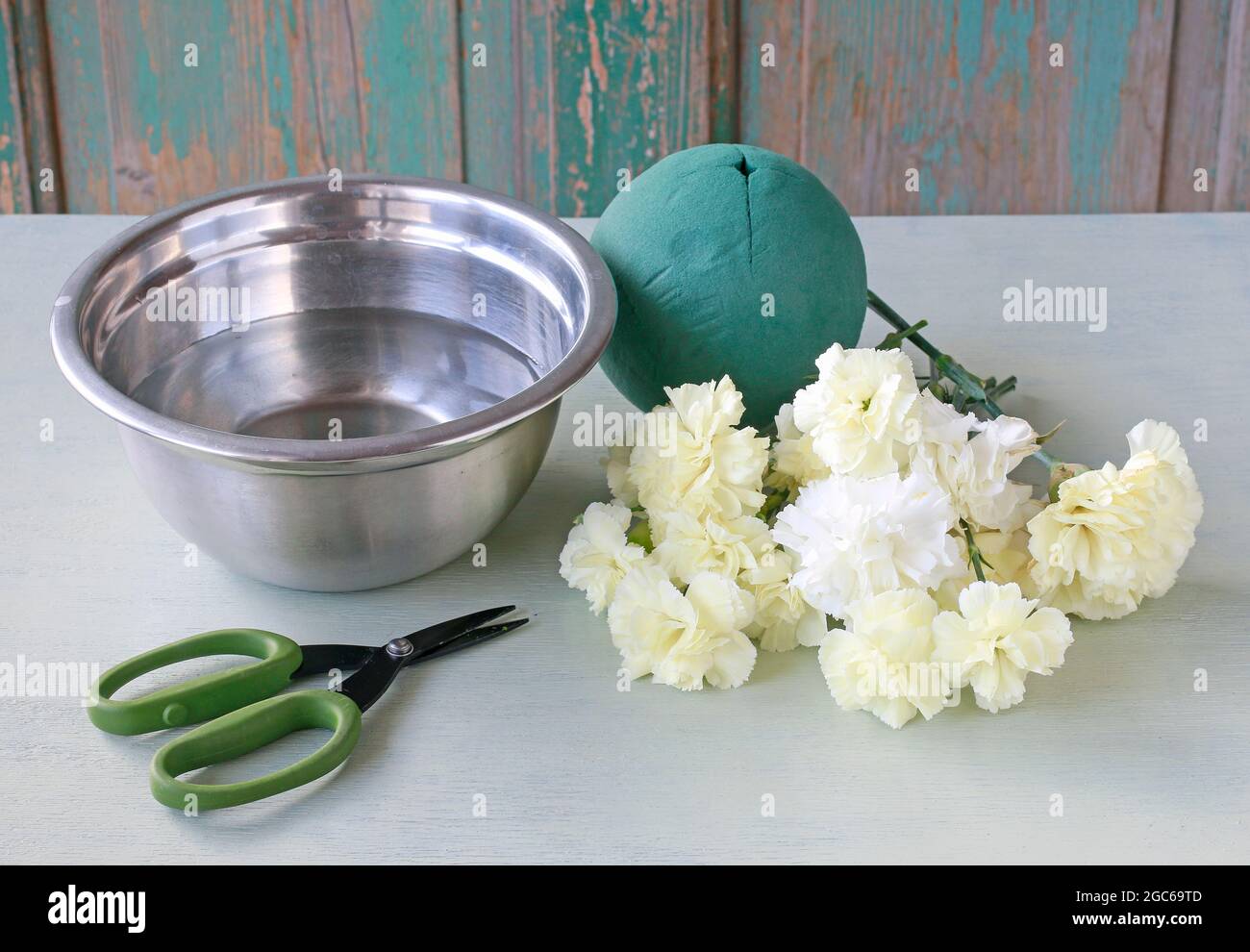 Florist at work: How to make carnation pomander ball, popular wedding decoration. Step by step ...